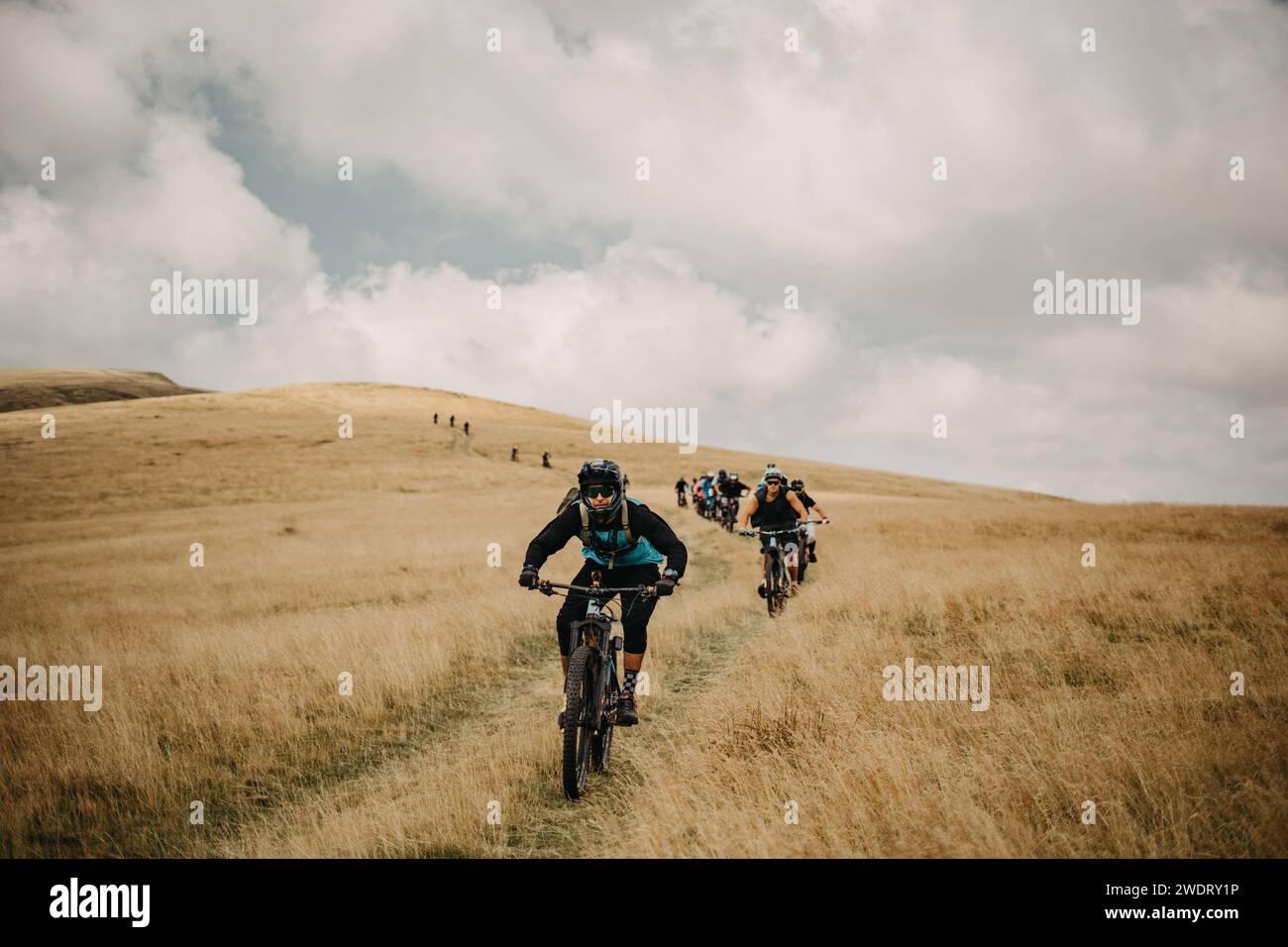 Group of young people exploring nature with e-bikes Stock Photo - Alamy