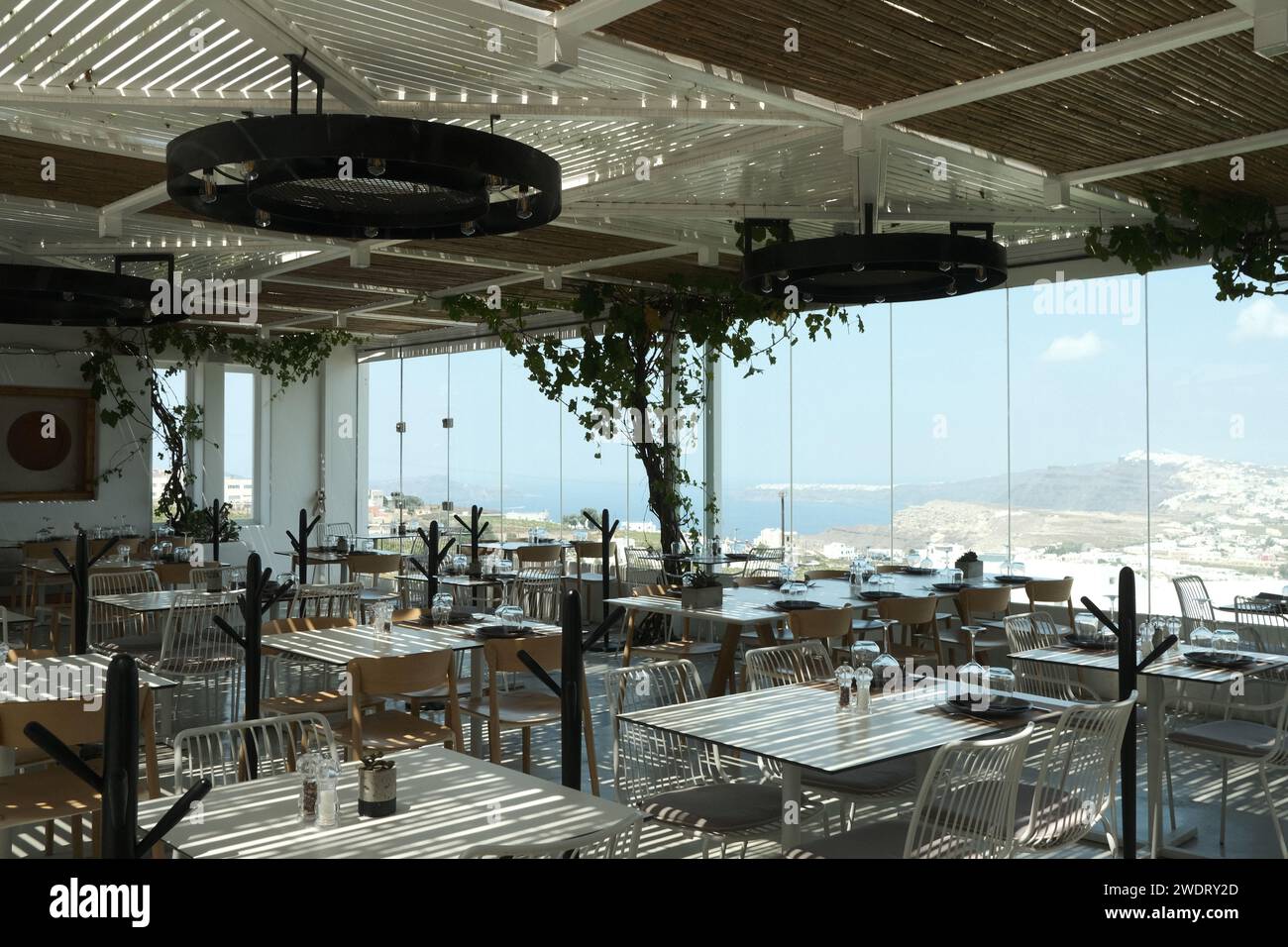 Quiet restaurant with interesting natural light Stock Photo - Alamy
