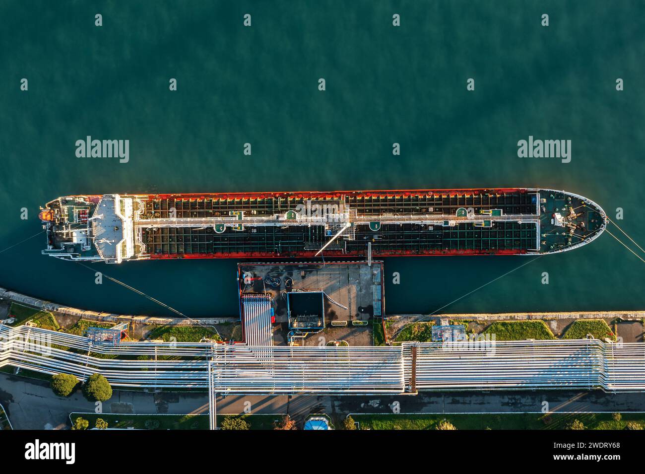 Aerial top down view oil ship tanker vessel loading in gas and oil ...
