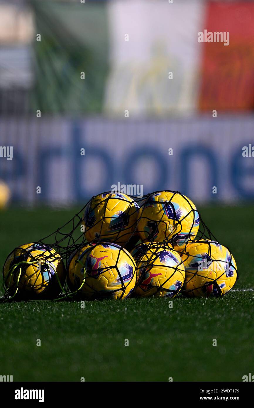 A net full of balls is seen with an italian flag on the background ...
