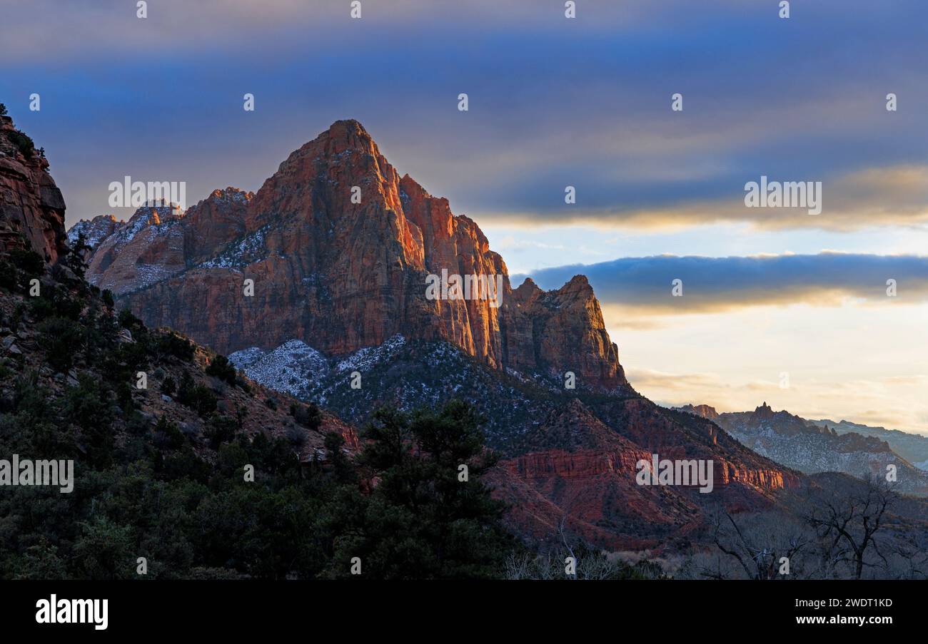 The last light of the setting sun lights up the west side of The ...