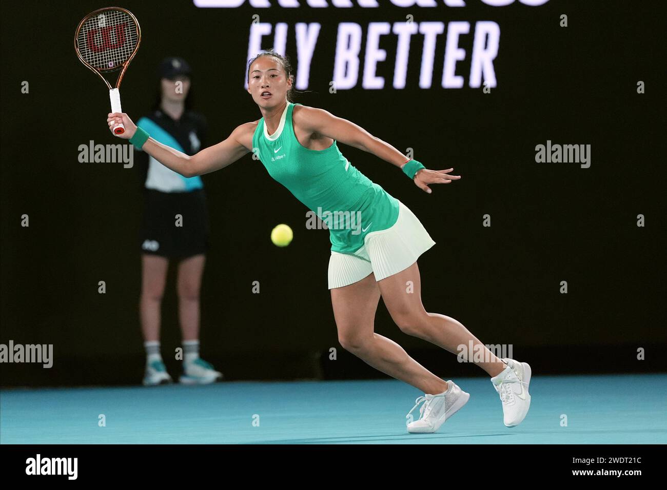 Zheng Qinwen of China plays a forehand return to Oceane Dodin of France during their fourth ...