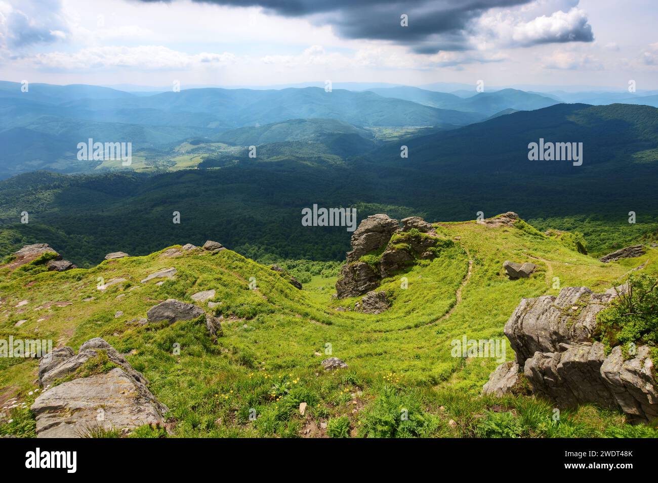 mountainous alpine scenery in summer. steep grassy slopes with stones ...