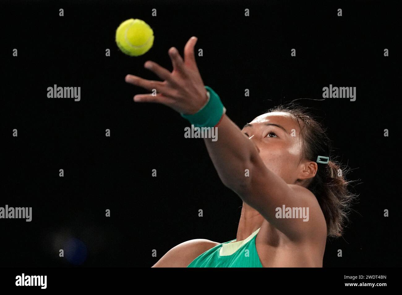 Zheng Qinwen of China serves to Oceane Dodin of France during their fourth round match at the ...