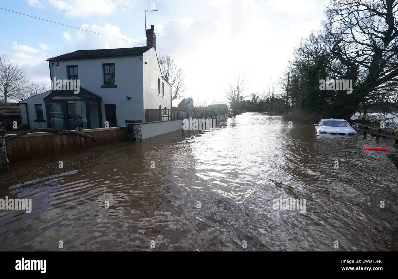 A car stranded in flood water in Warwick bridge in Cumbria. Thousands ...