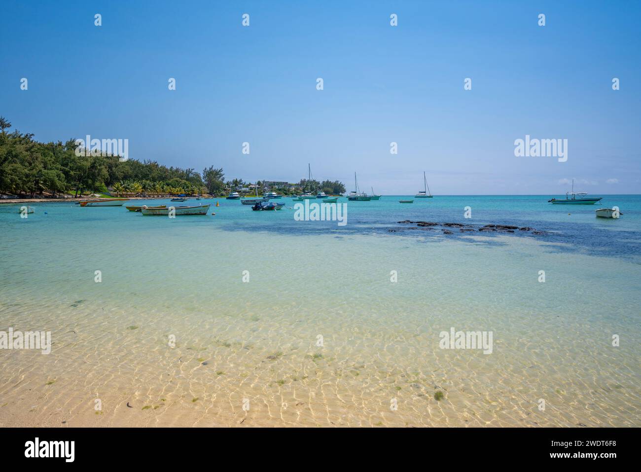 View of beach and turquoise Indian Ocean on sunny day in Cap Malheureux ...