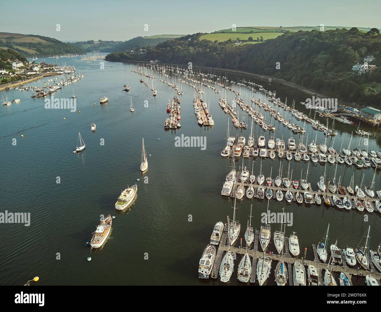 An aerial view of the estuary of the River Dart, with the towns of ...