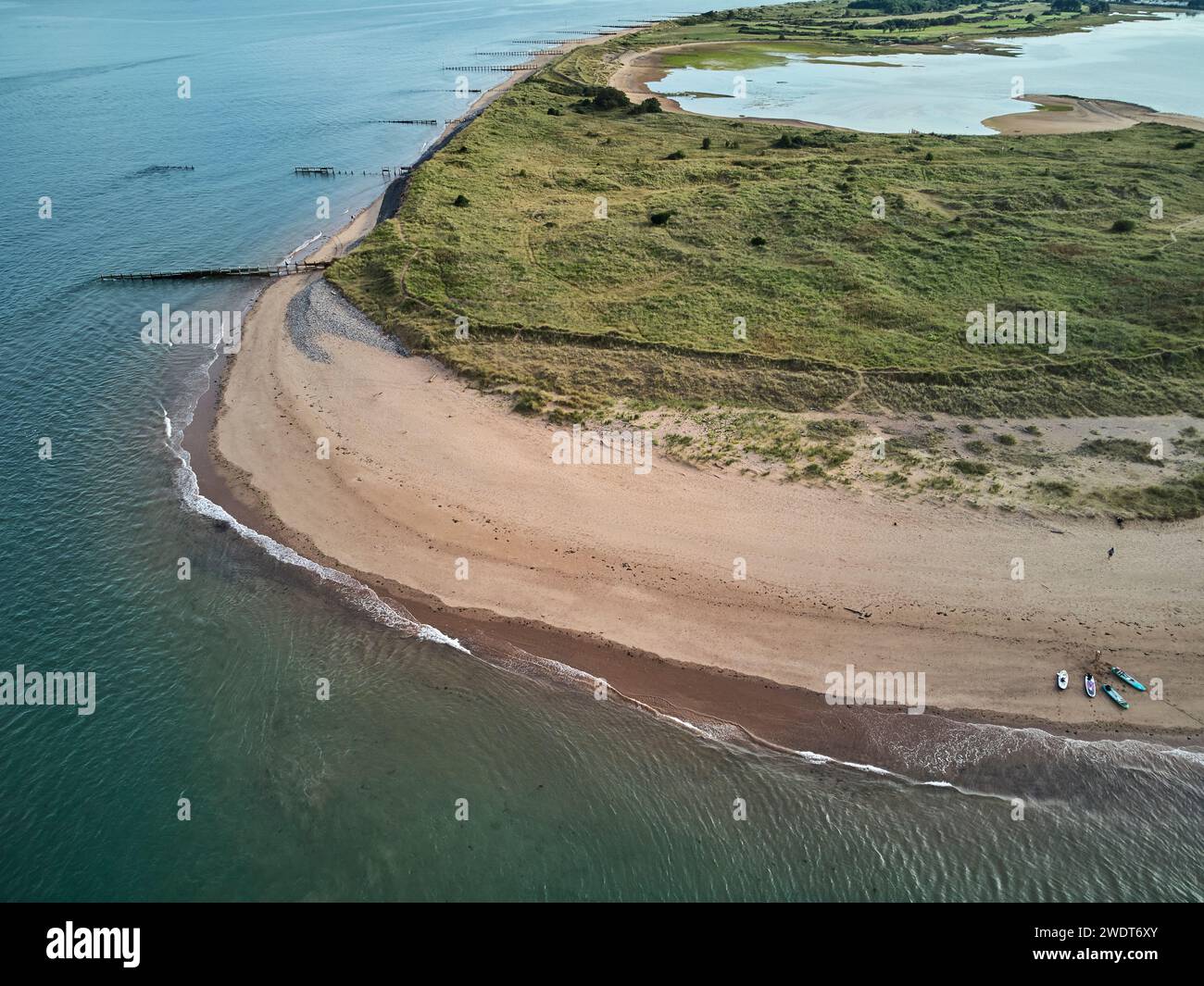 Aerial view of beach and dunes at Dawlish Warren, guarding the mouth of ...