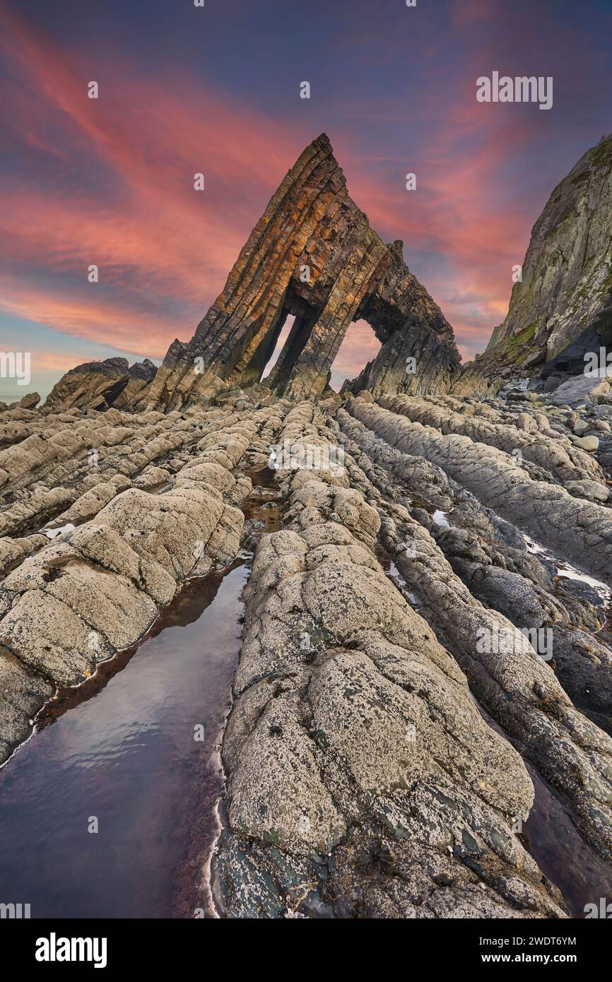 The massive triangle of Blackchurch Rock, on the north coast of Devon ...