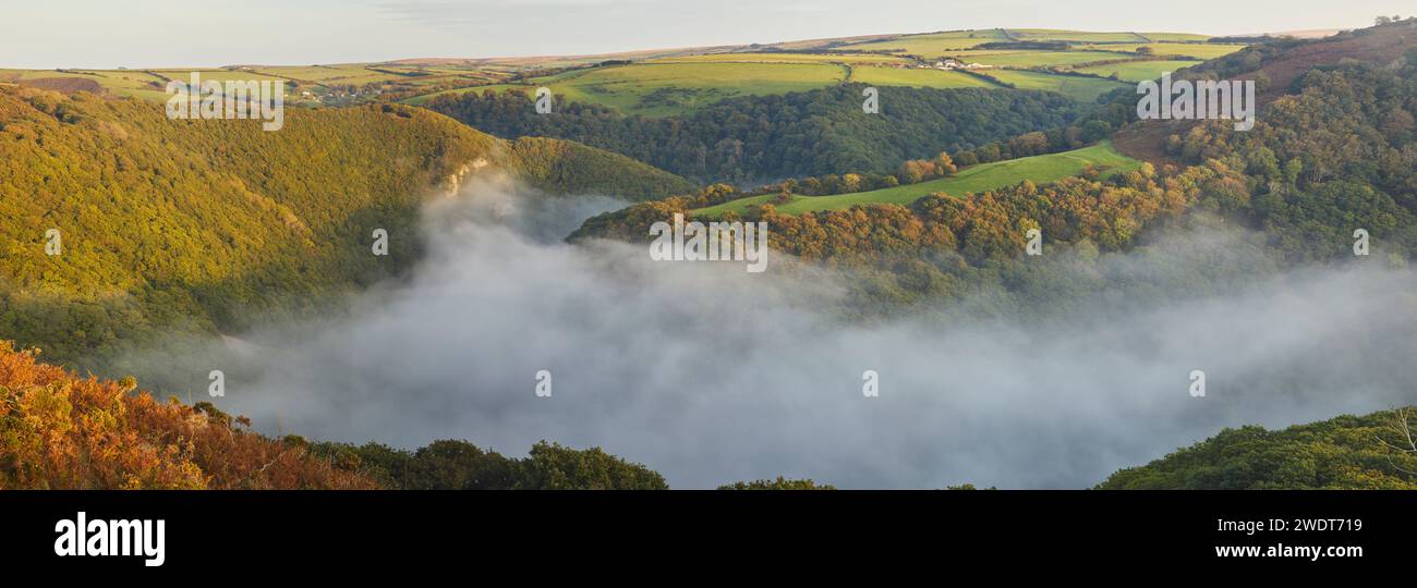 Evening mist in the valley of the East Lyn River, near Lynmouth, Exmoor ...