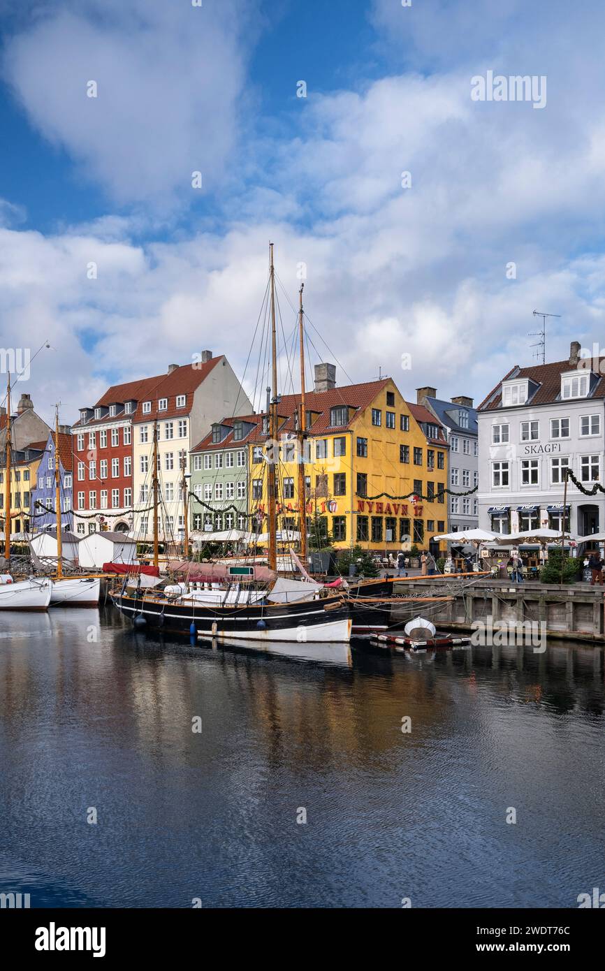 Colourful buildings and tall masted boats on the waterfront at Nyhavn ...