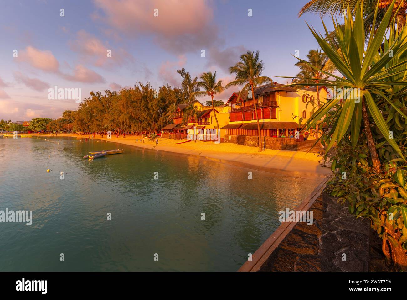 View of beach and boats in Grand Bay at golden hour, Mauritius, Indian ...