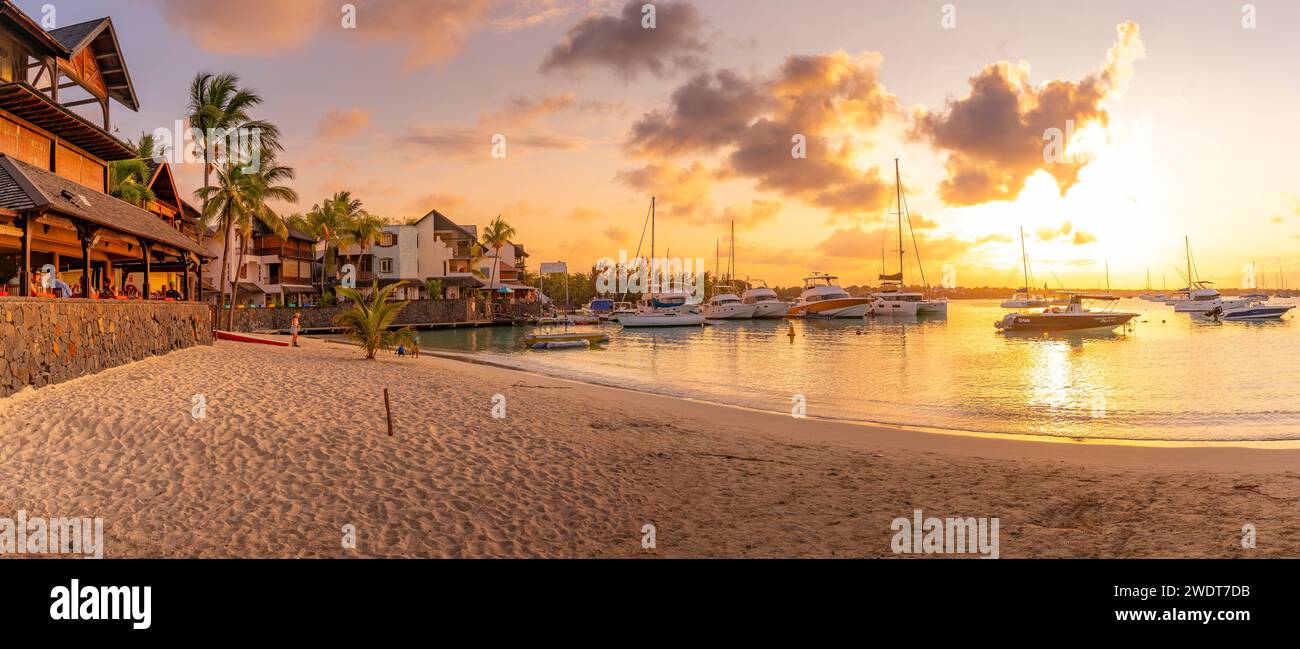 View of beach and boats in Grand Bay at golden hour, Mauritius, Indian ...