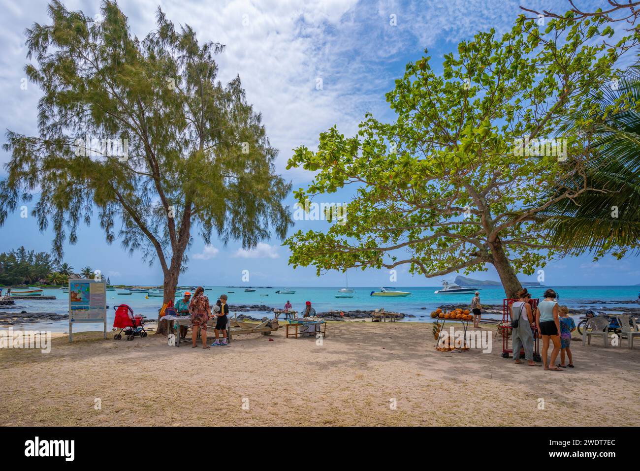View of beach and traders on sunny day in Cap Malheureux, Mauritius ...