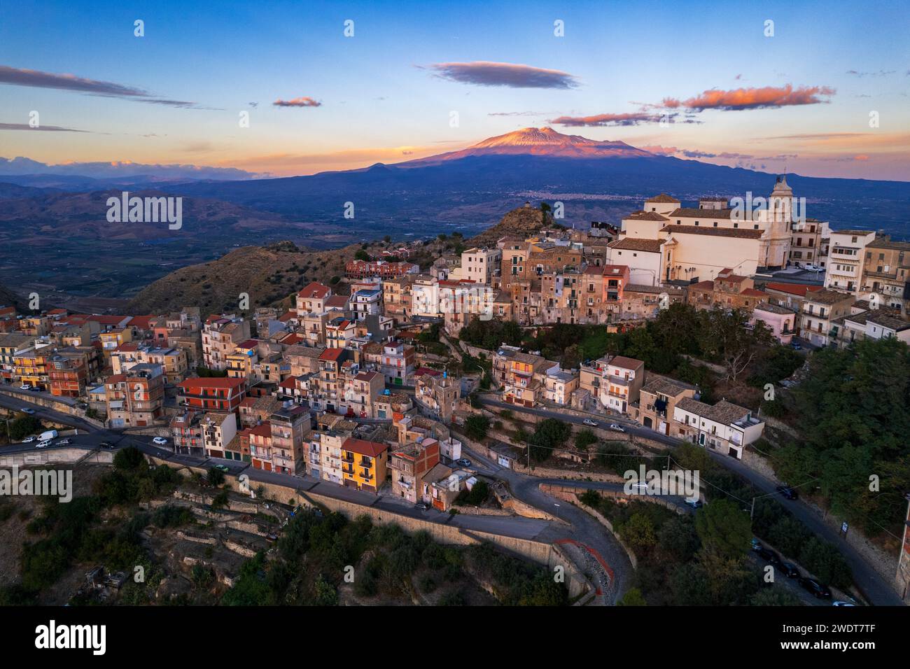 Aerial view of the old village of Centuripe with Mount Etna volcano ...