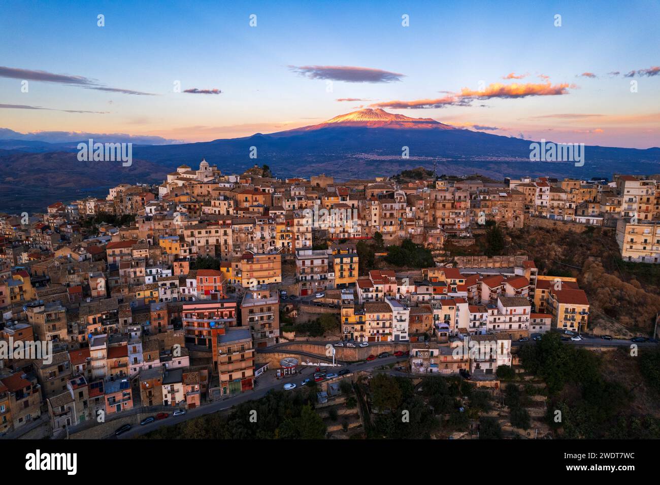 Aerial view of the old village of Centuripe with Mount Etna volcano ...