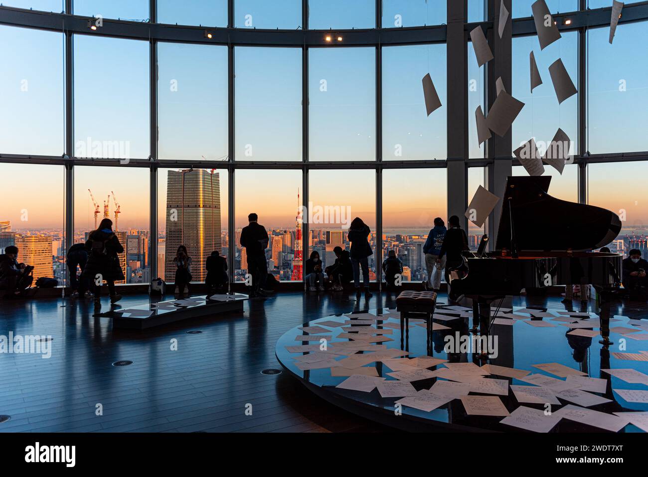 Panoramic view through a big window in Roppongi Hills, with visitors ...