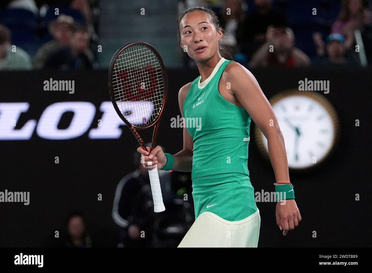 Zheng Qinwen of China reacts after defeating Oceane Dodin of France in their fourth round match ...