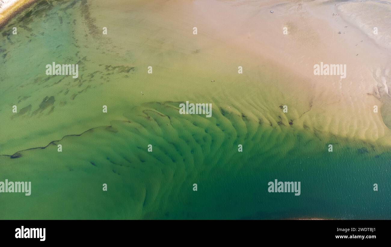 Aerial view of river, sandy shallows, and people strolling. The Tina ...