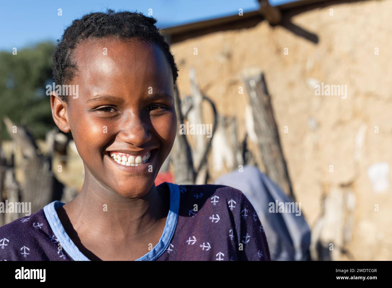 African Teenager Girl With Braids Shack Made Out Of Mud In The