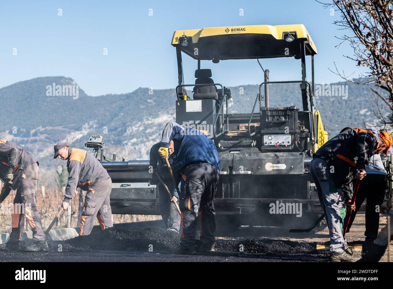 Road Construction Site Stock Photos, Laying new asphalt surface, Heavy ...