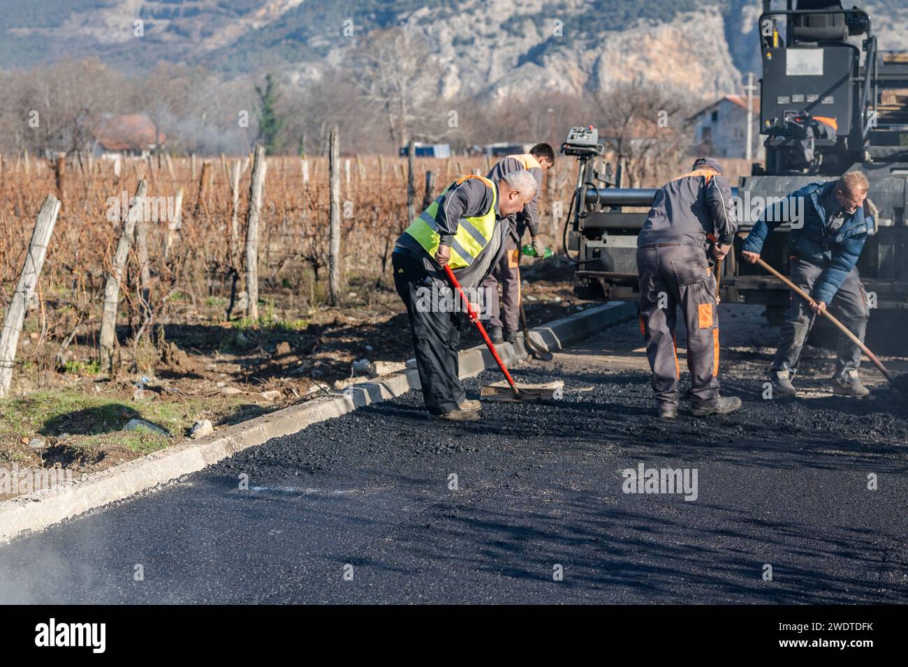 Road Construction Site Stock Photos, Laying new asphalt surface, Heavy ...