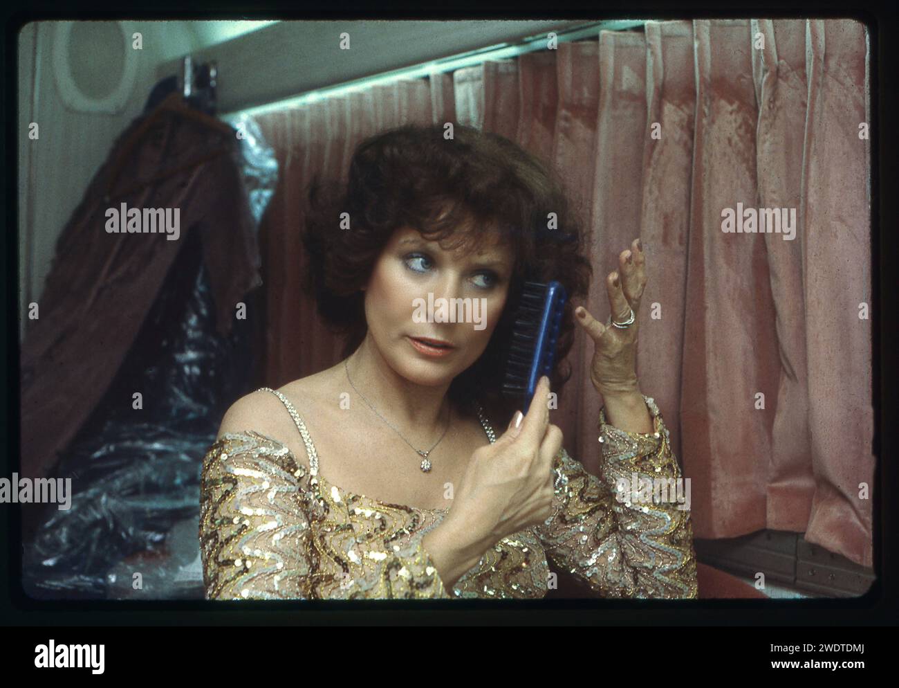 Country music superstar Loretta Lynn combs her hair on her tour bus ...
