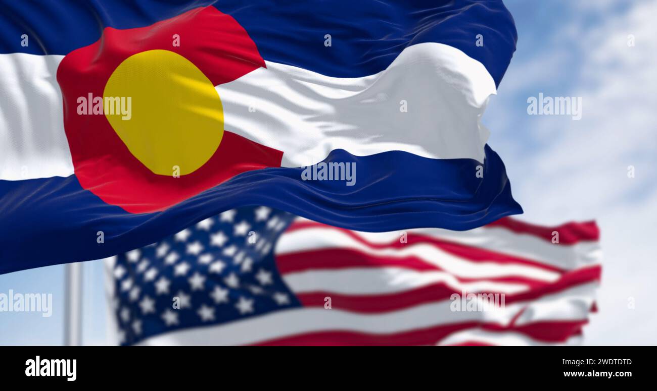 Colorado state flags waving with the national flags of the United ...