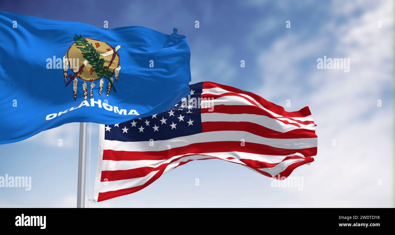 The Oklahoma state flag waving the american national flag. Oklahoma is ...
