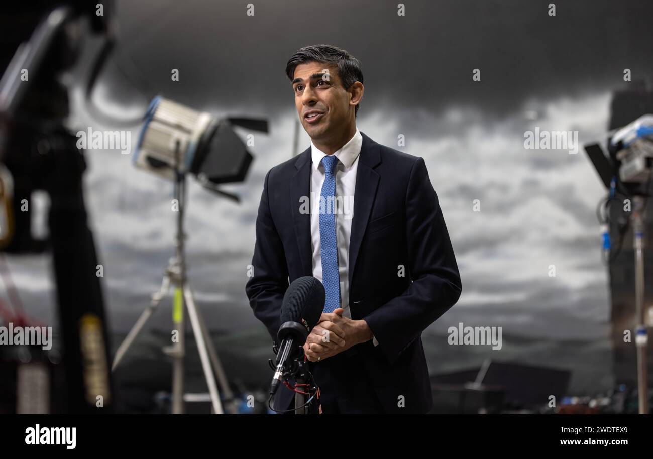 Prime Minister Rishi Sunak speaks to the media in front of a painted ...