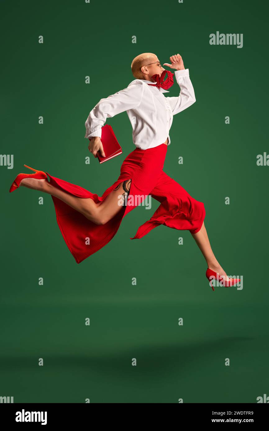 Hurry up. Dynamic side view portrait of business lady in trendy office ...