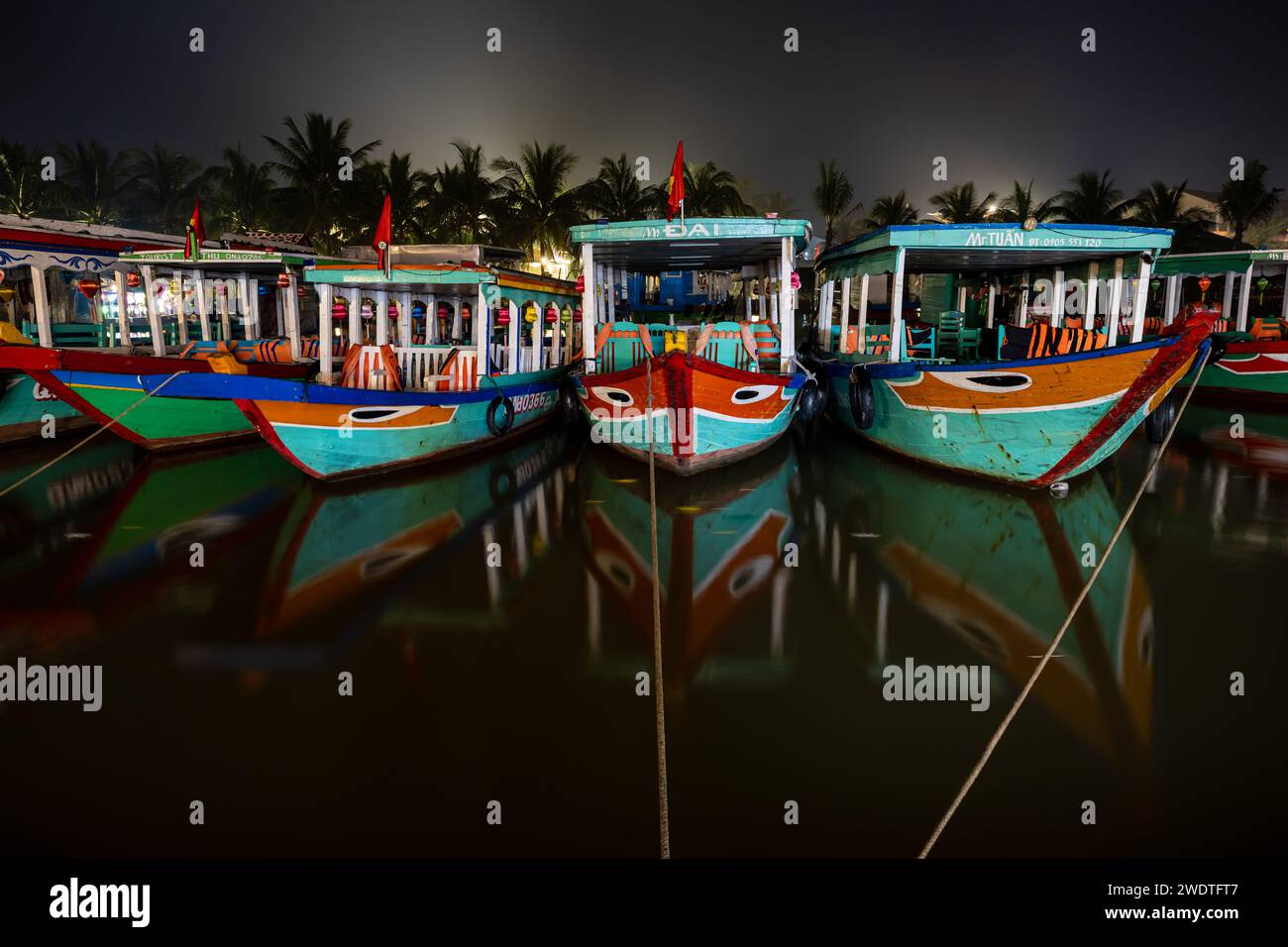 Romanic tourist boats with lanterns in the historic village of Hoi An ...
