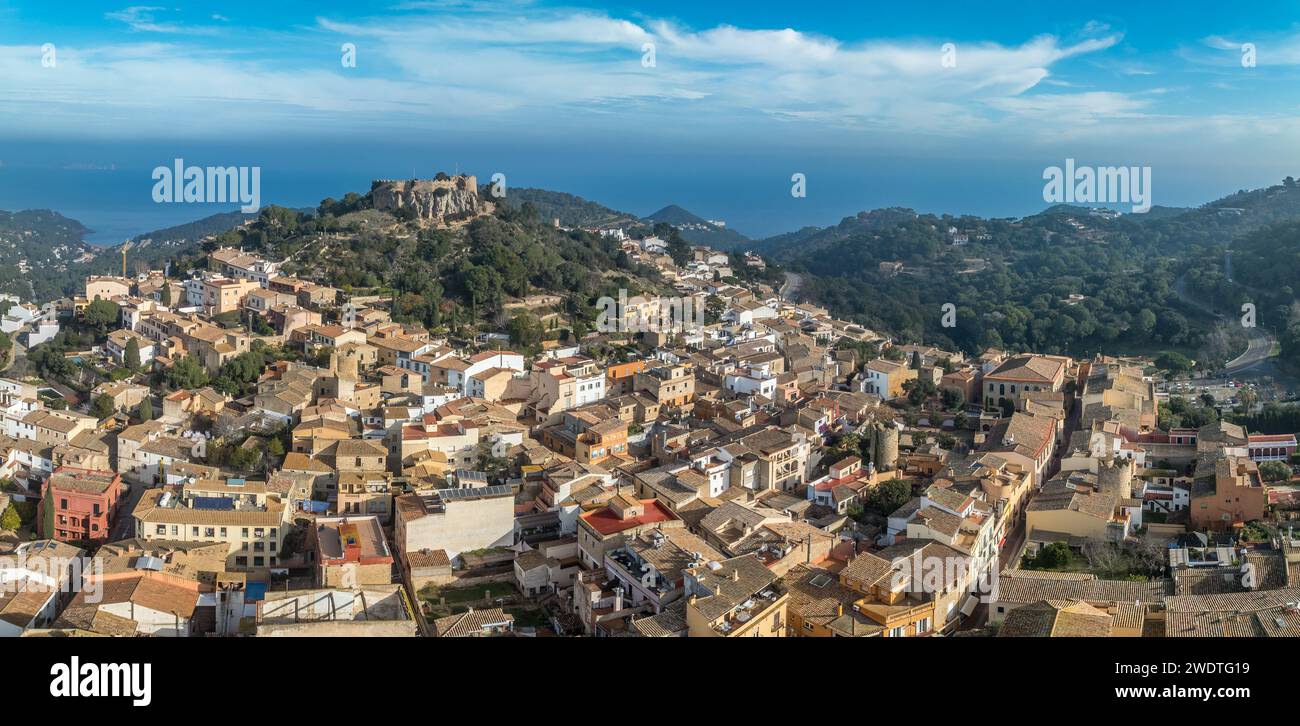 Remains of a 16th-century Begur castle fort atop a forested hill, with ...