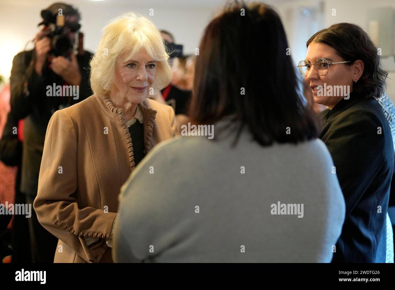 Queen Camilla speaks with attendees during a visit to the Swindon ...