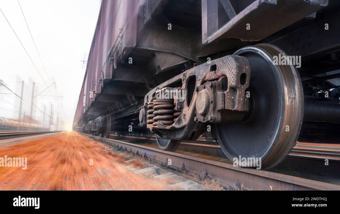 A heavy freight train travels quickly by rail. Sensation of movement by ...