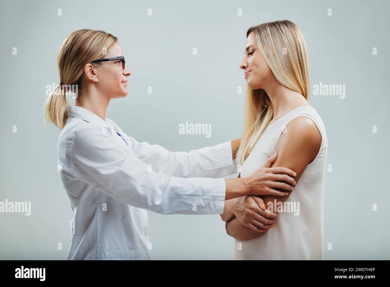 Positive healthcare interaction captured as a doctor attentively ...