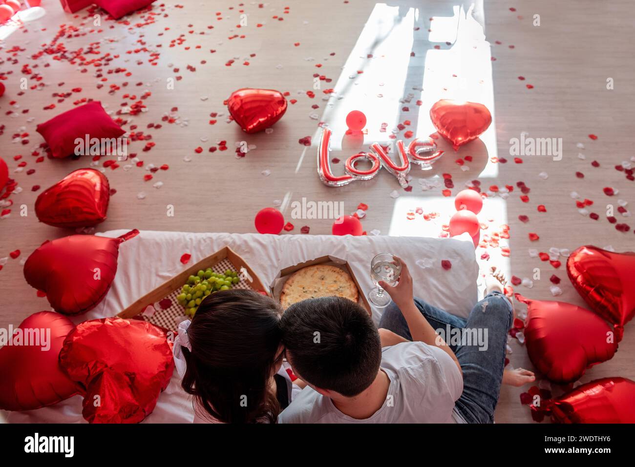 Top view of young couple sharing casual, intimate moment together on ...