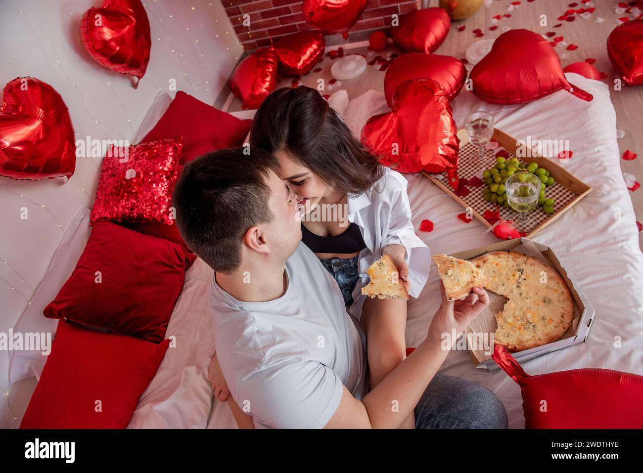 Romantic couple kissing in bed hi-res stock photography and images - Alamy