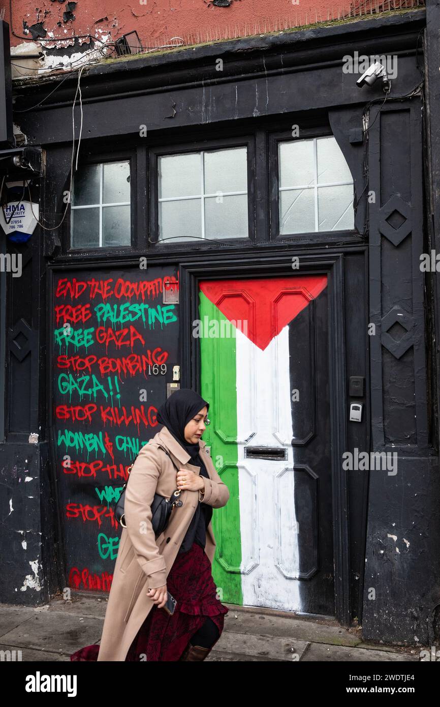 London, UK. 21st January, 2024. A member of the public passes artwork ...