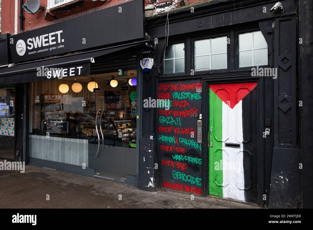 London, UK. 21st January, 2024. Artwork featuring a Palestinian flag is ...