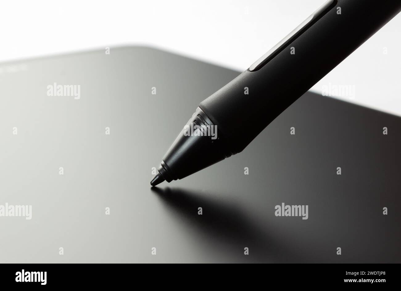 Pen on graphic tablet. Side view on white background. Tool for ...