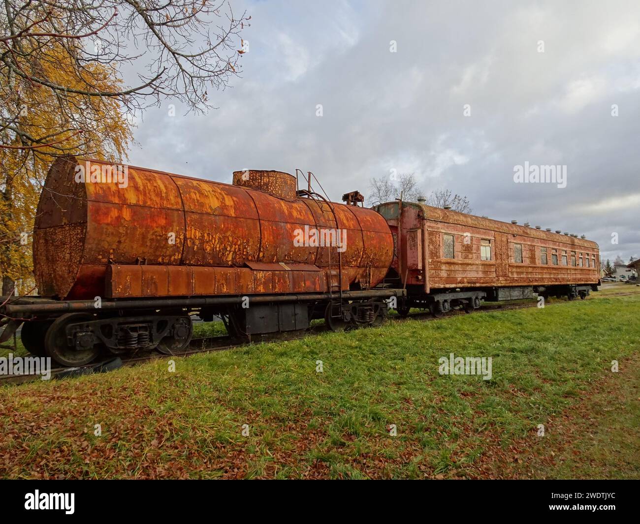 Old rusty trains. Old abandoned track siding with dirty old trains. Old ...