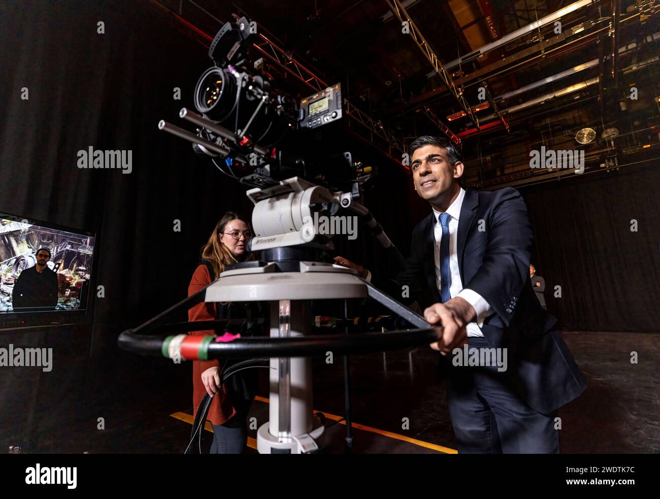 Britain's Prime Minister Rishi Sunak operates a TV studio floor camera ...