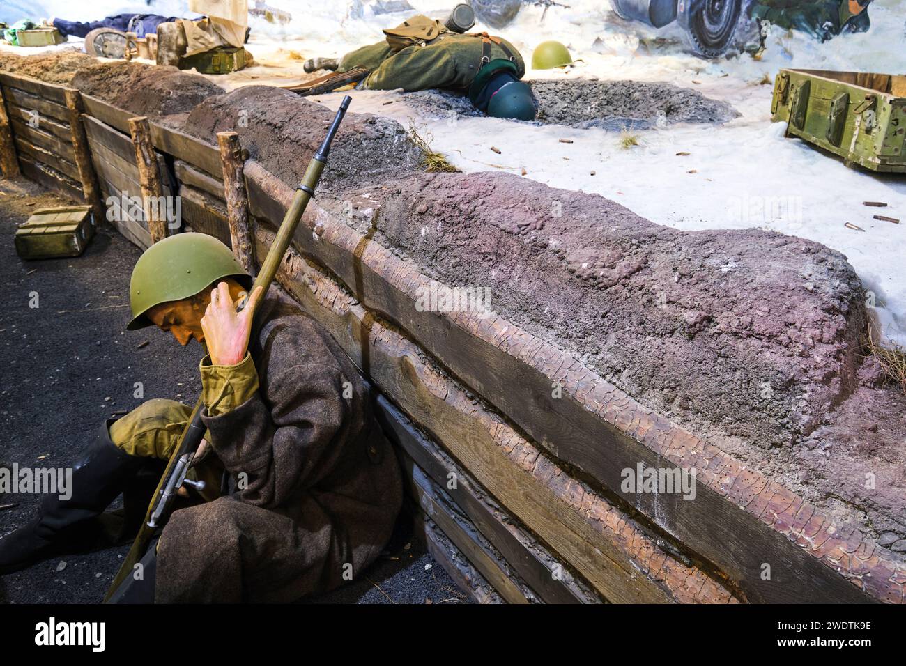 Detail of a Soviet, Russian soldier taking cover in a dug out trench ...