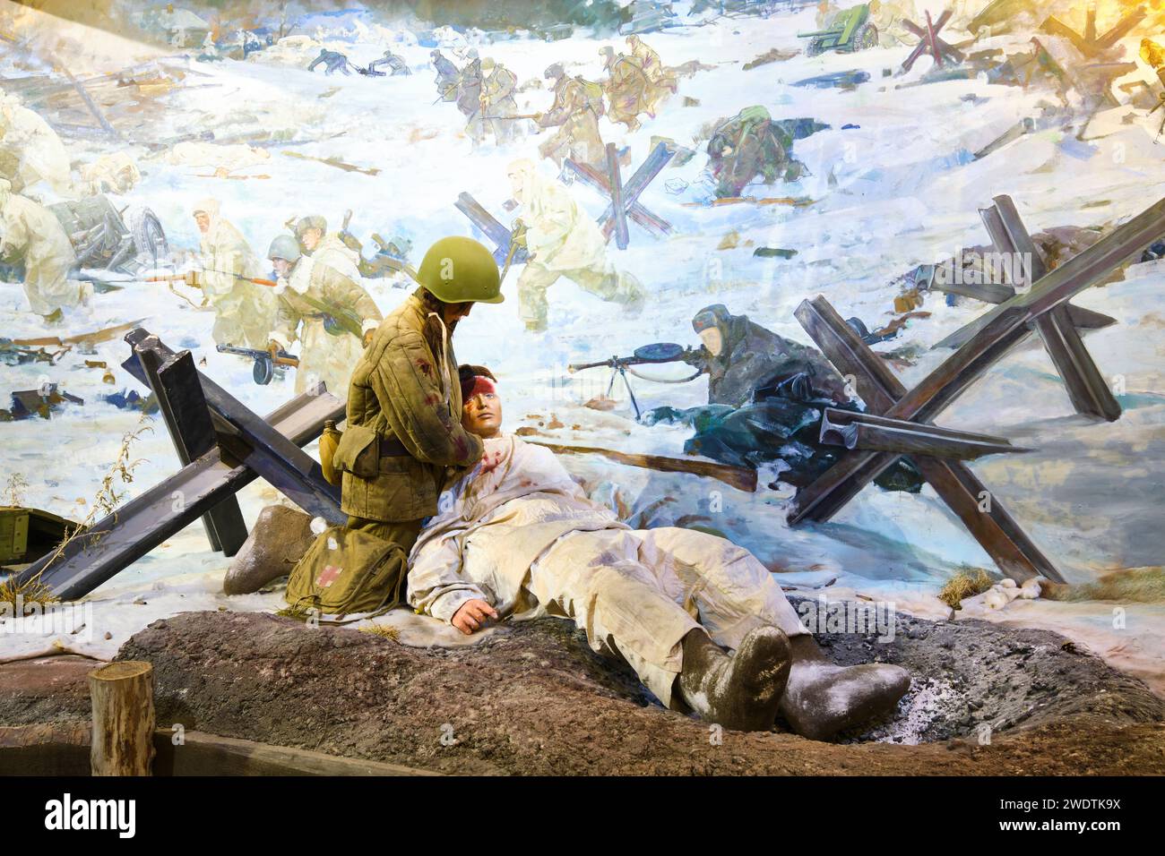 A detail of an injured Soviet soldier with a bloody head wound being ...