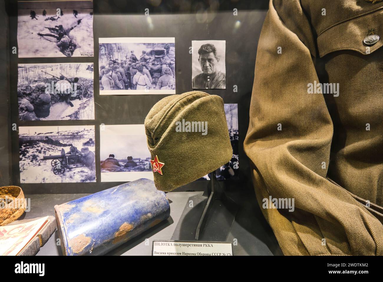 A display featuring an olive green, wool typical Soviet soldier uniform ...