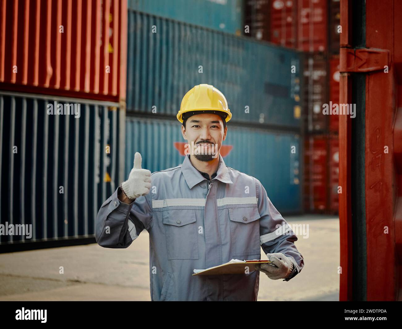 Happy Engineer OR Worker standing proudly at container cargo yard Stock ...