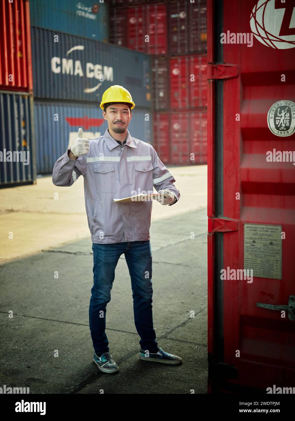 Engineer OR Worker is writing and check on checklist document during safety audit and inspection ...