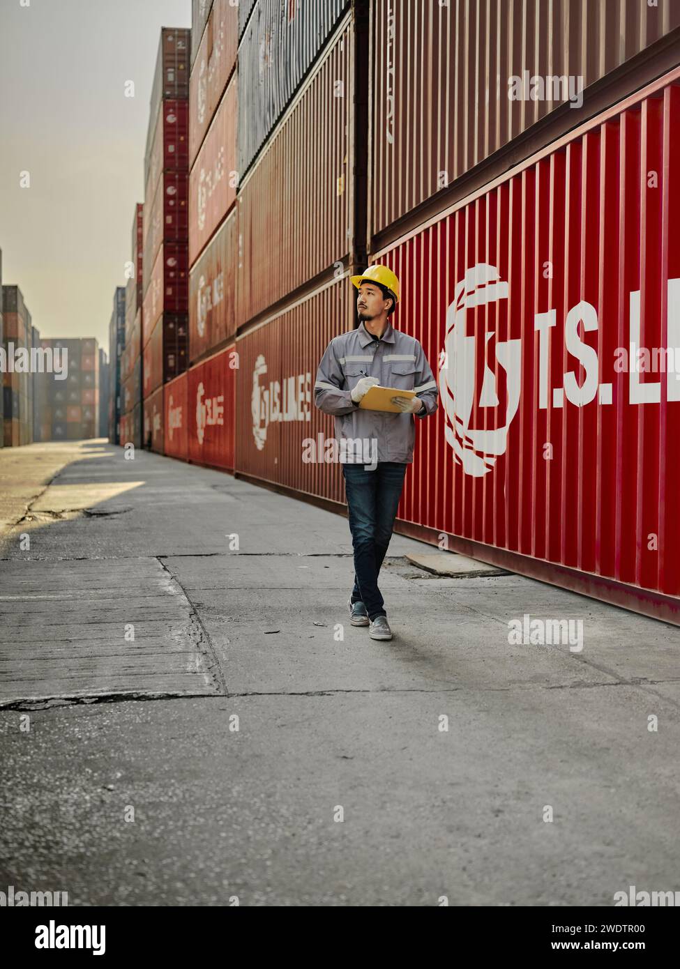 Engineer OR Worker is writing and check on checklist document during safety audit and inspection ...