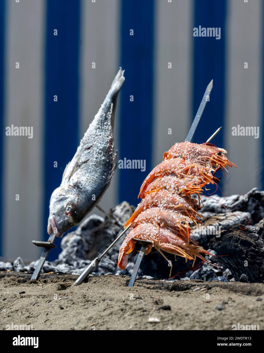 Seafood cooking on beach barbecue Stock Photo - Alamy